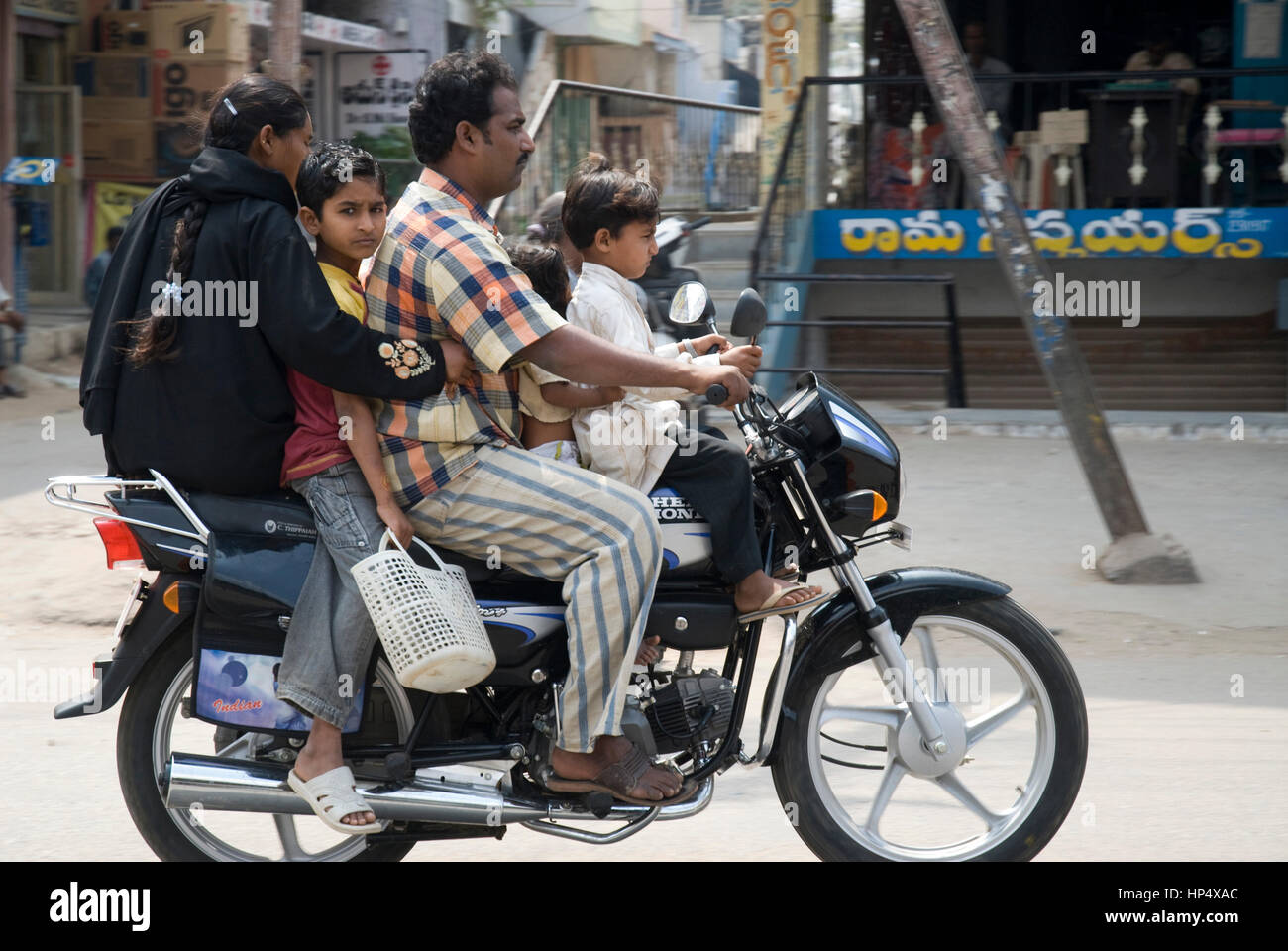 Family on a motorcycle hi-res stock photography and images - Alamy