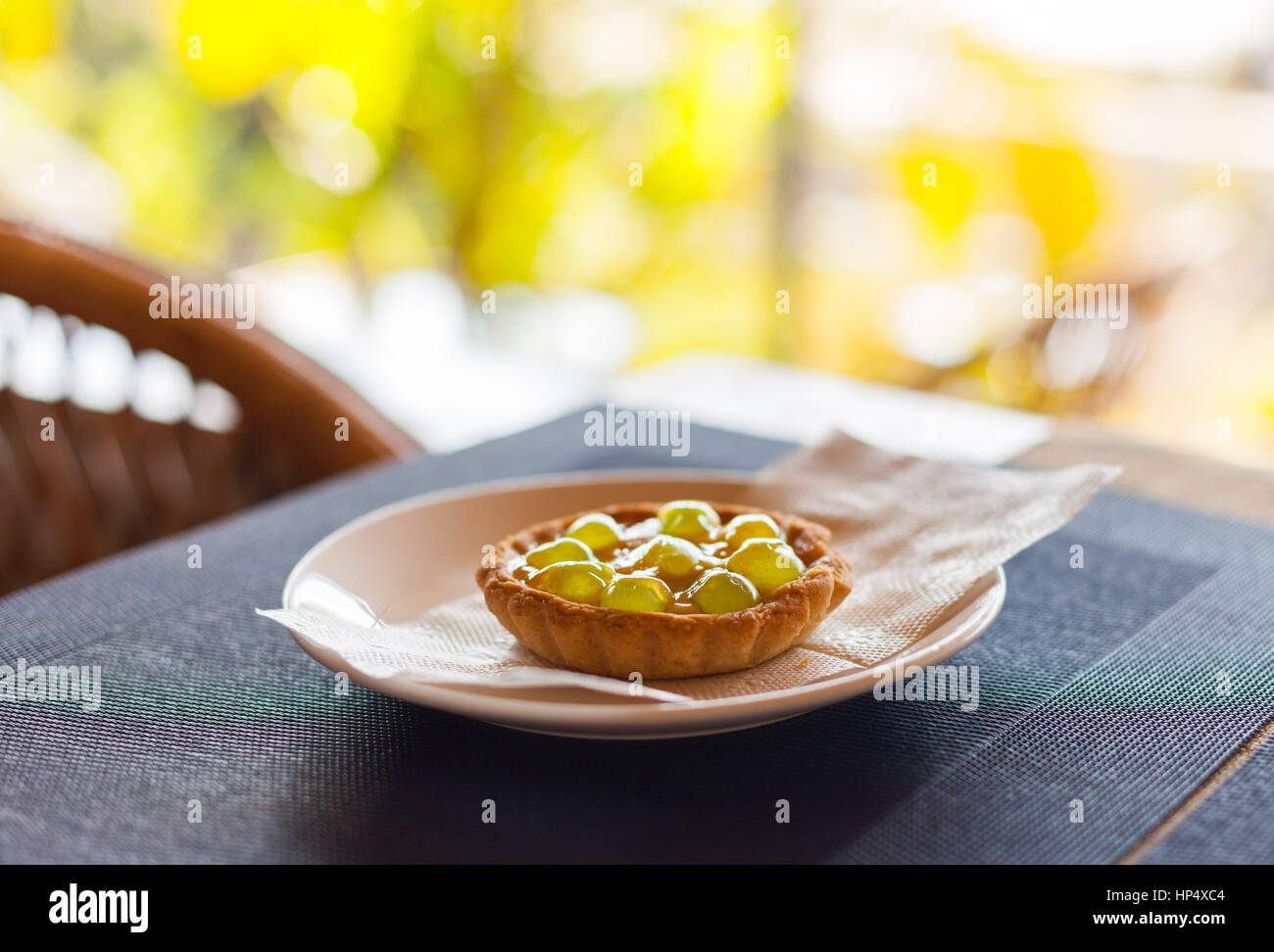 Belgian fruit tart on a sunny cafe table Stock Photo - Alamy