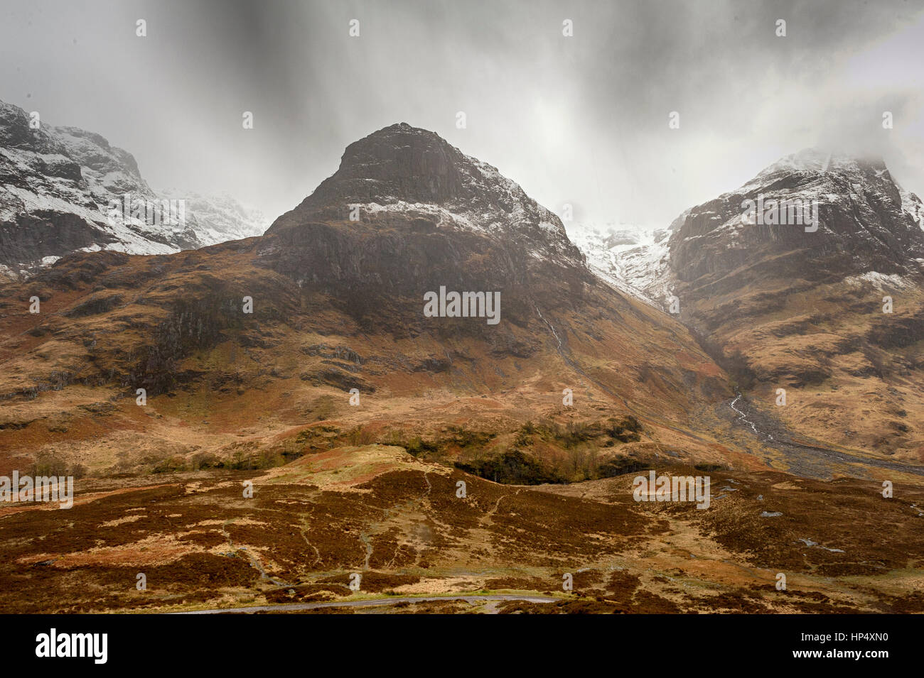 The mountains of Glencoe with snow on the peaks Stock Photo - Alamy