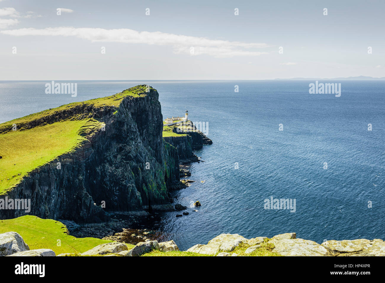 View on Niest Point with a lighthouse on the Isle of Skye Stock Photo ...