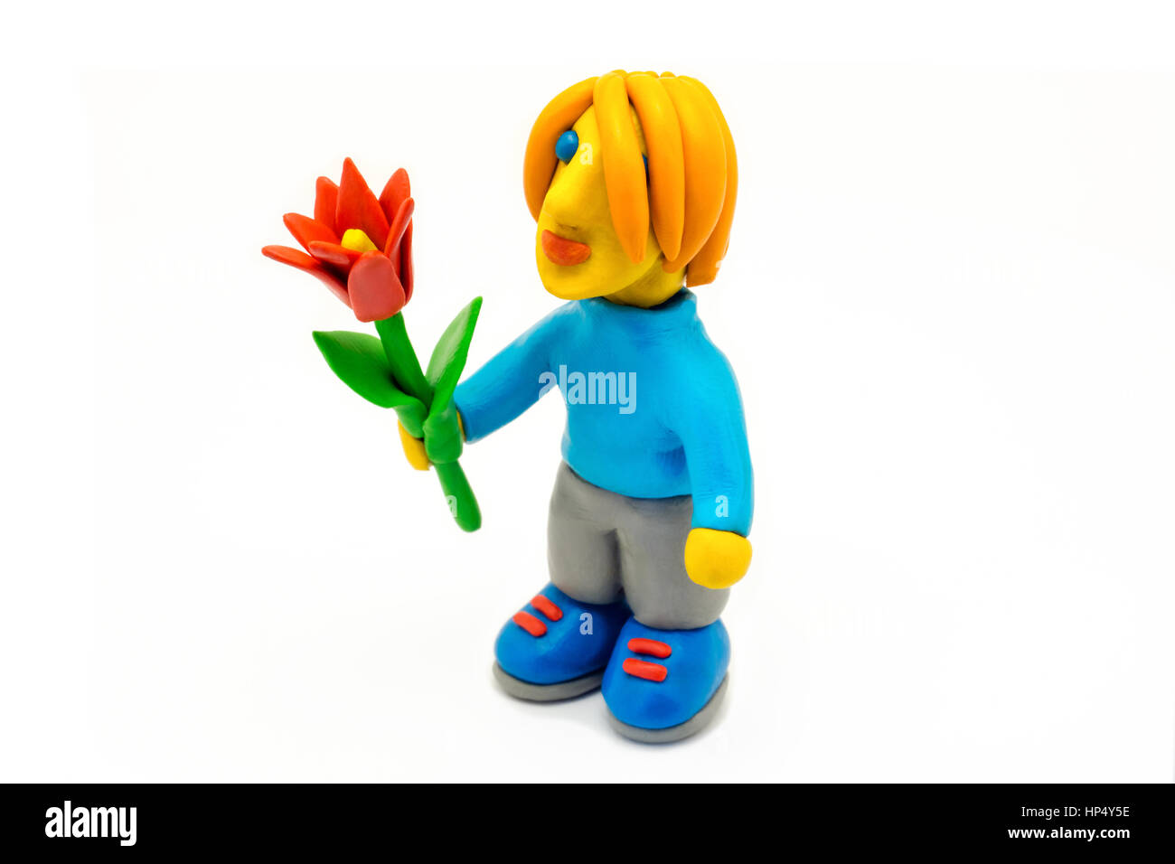 Plasticine boy with red flower Stock Photo - Alamy