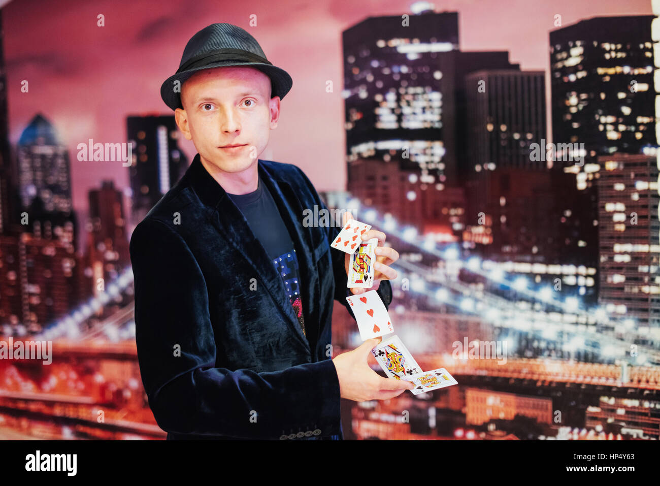 Portrait juggler magician is interesting black suit with cards i Stock ...