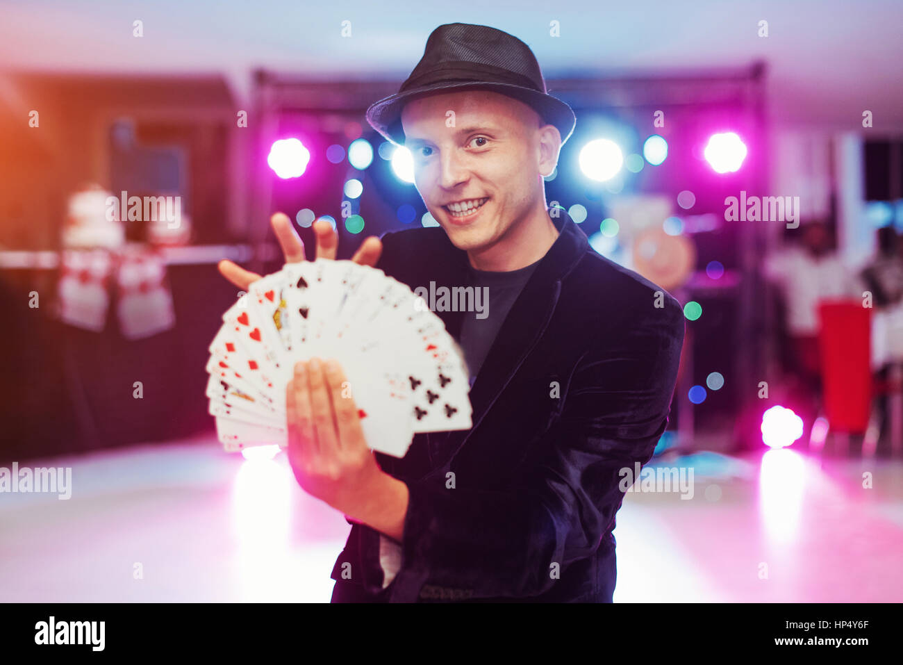 Magician showing trick with playing cards. Magic, circus Stock Photo ...