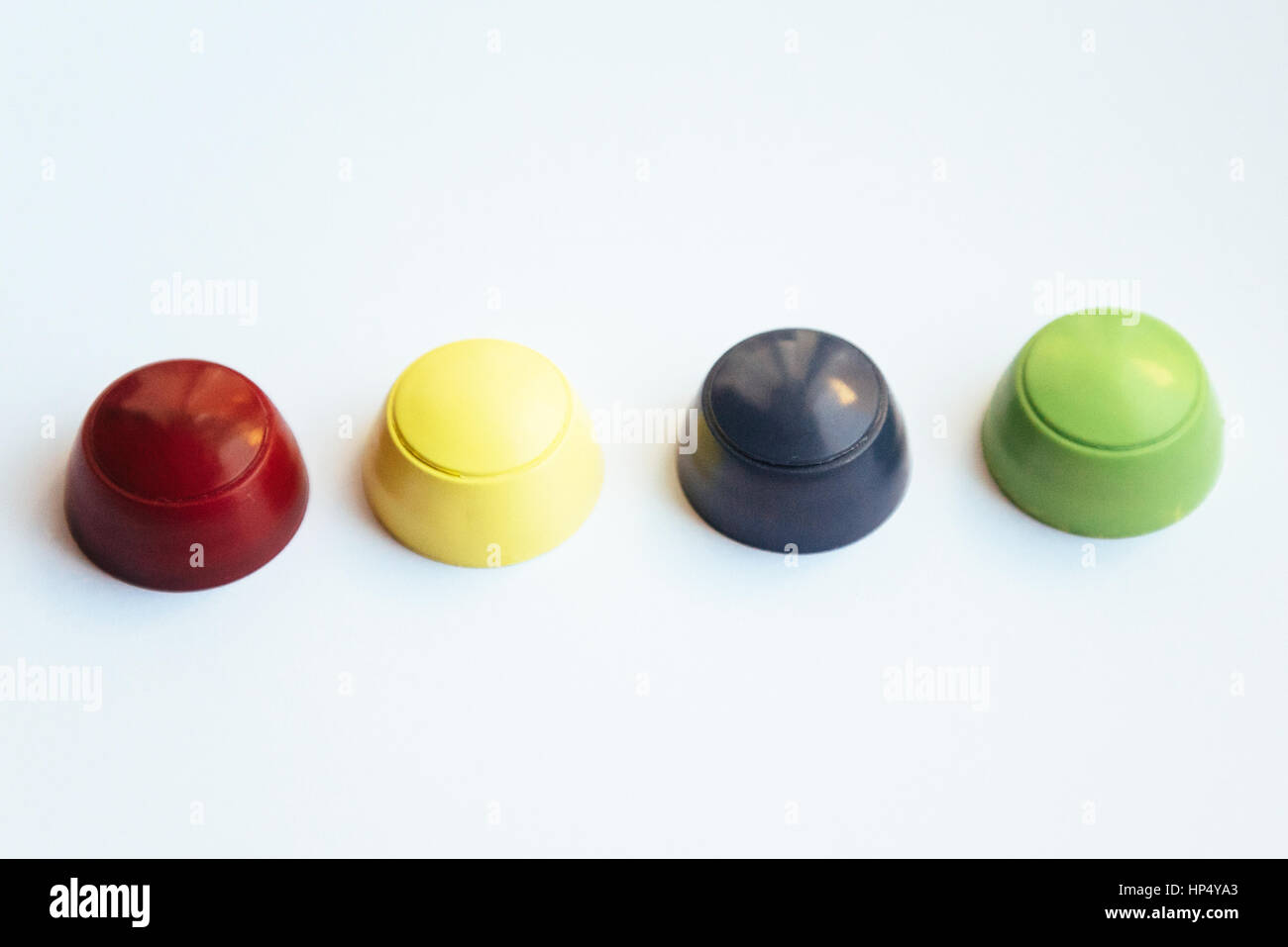 Colored plastic caps isolated on white background Stock Photo - Alamy