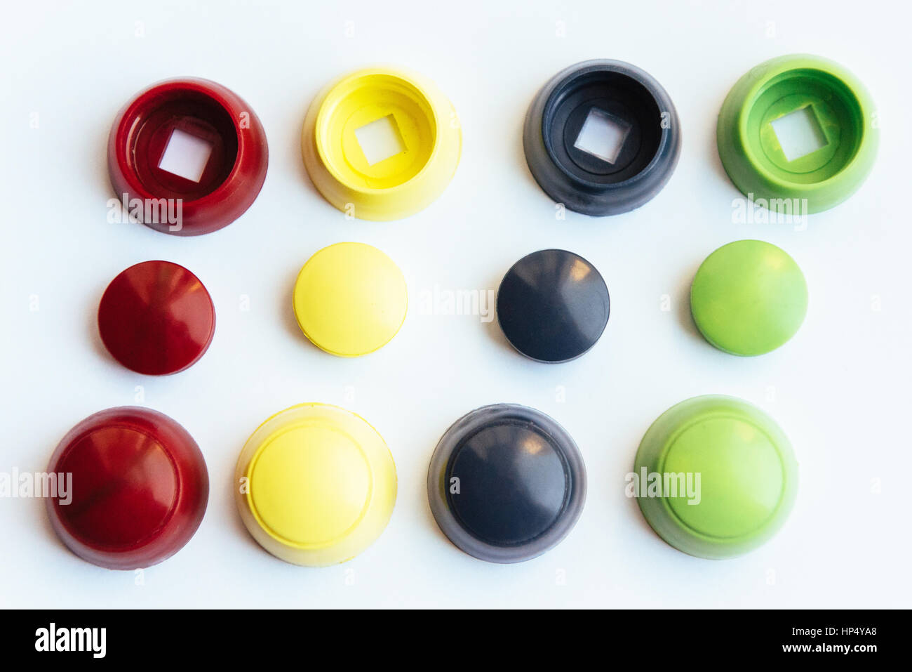 Colored plastic caps isolated on white background Stock Photo - Alamy