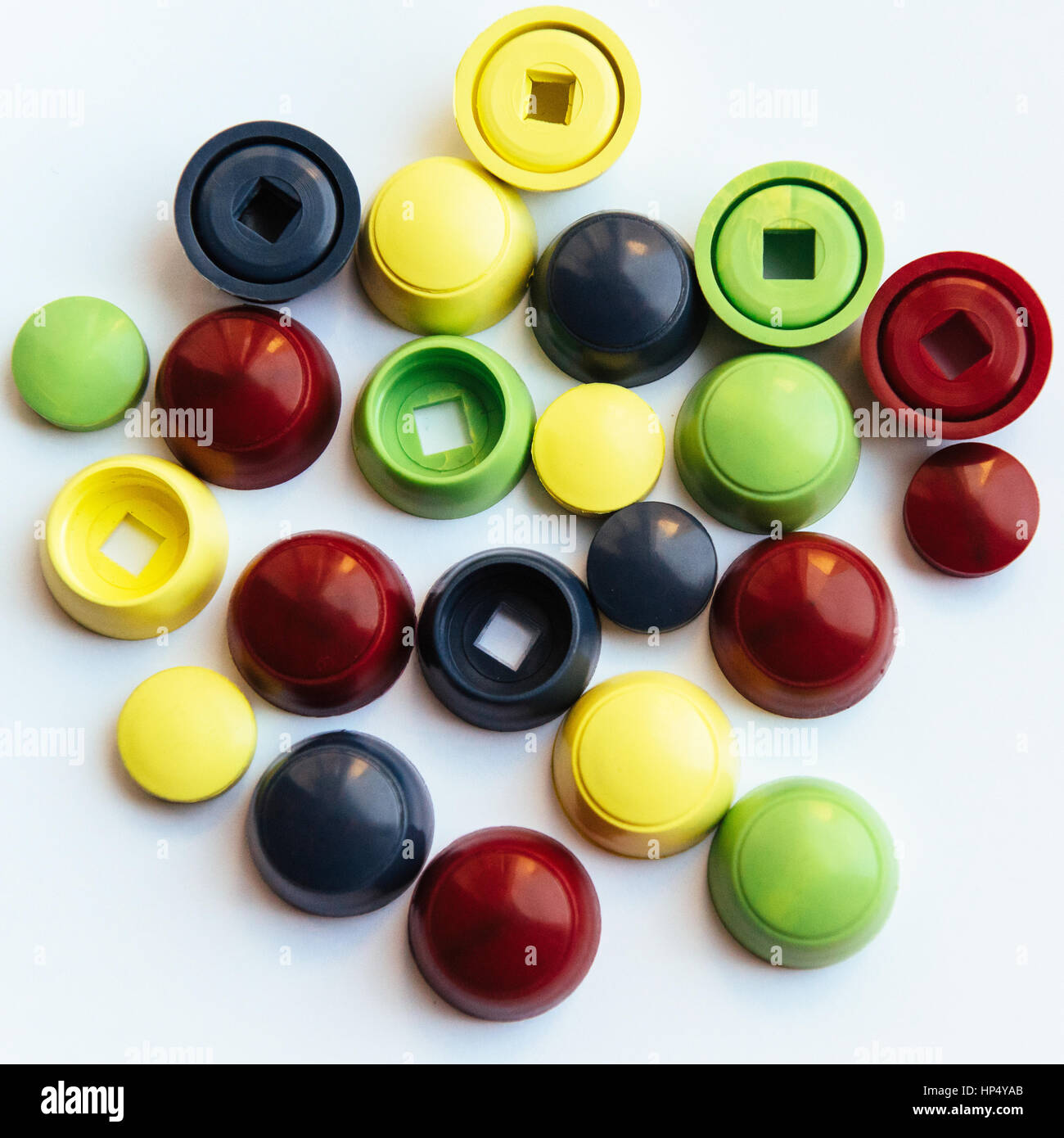 Colored plastic caps isolated on white background Stock Photo - Alamy