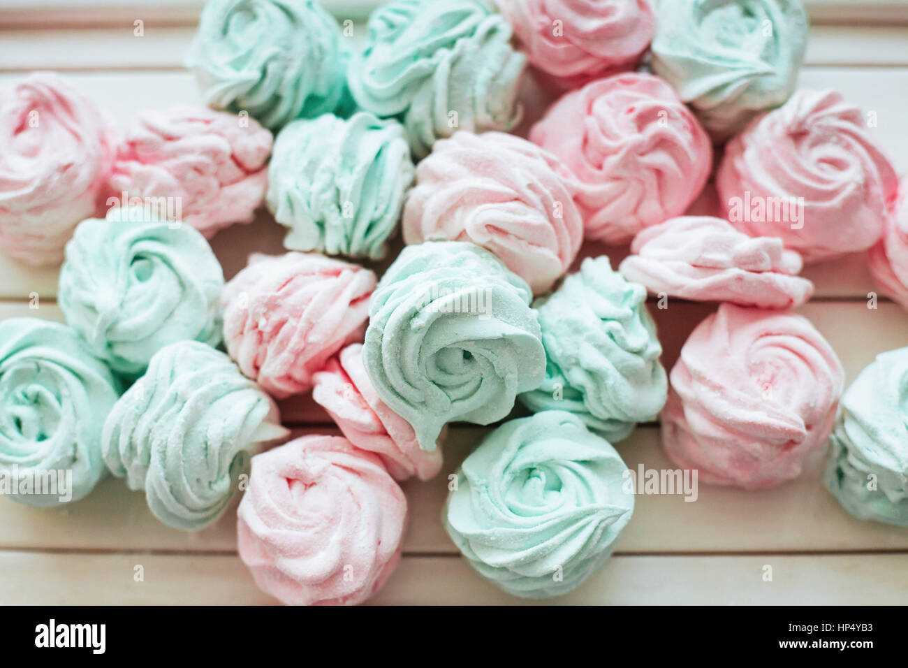 Delicious homemade marshmallow different colors on a white wooden ...