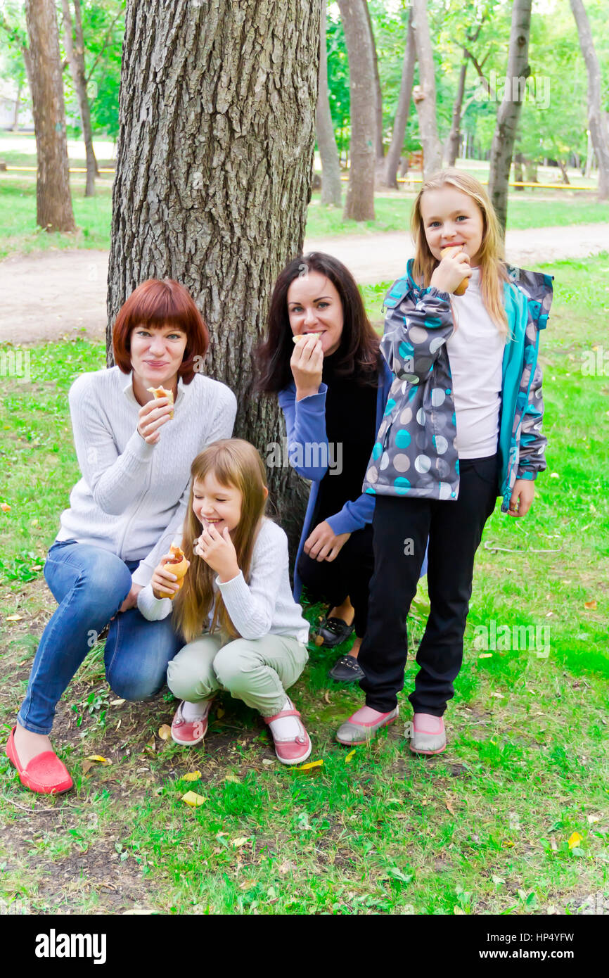 Photo of group laugh people are eating in summer Stock Photo - Alamy