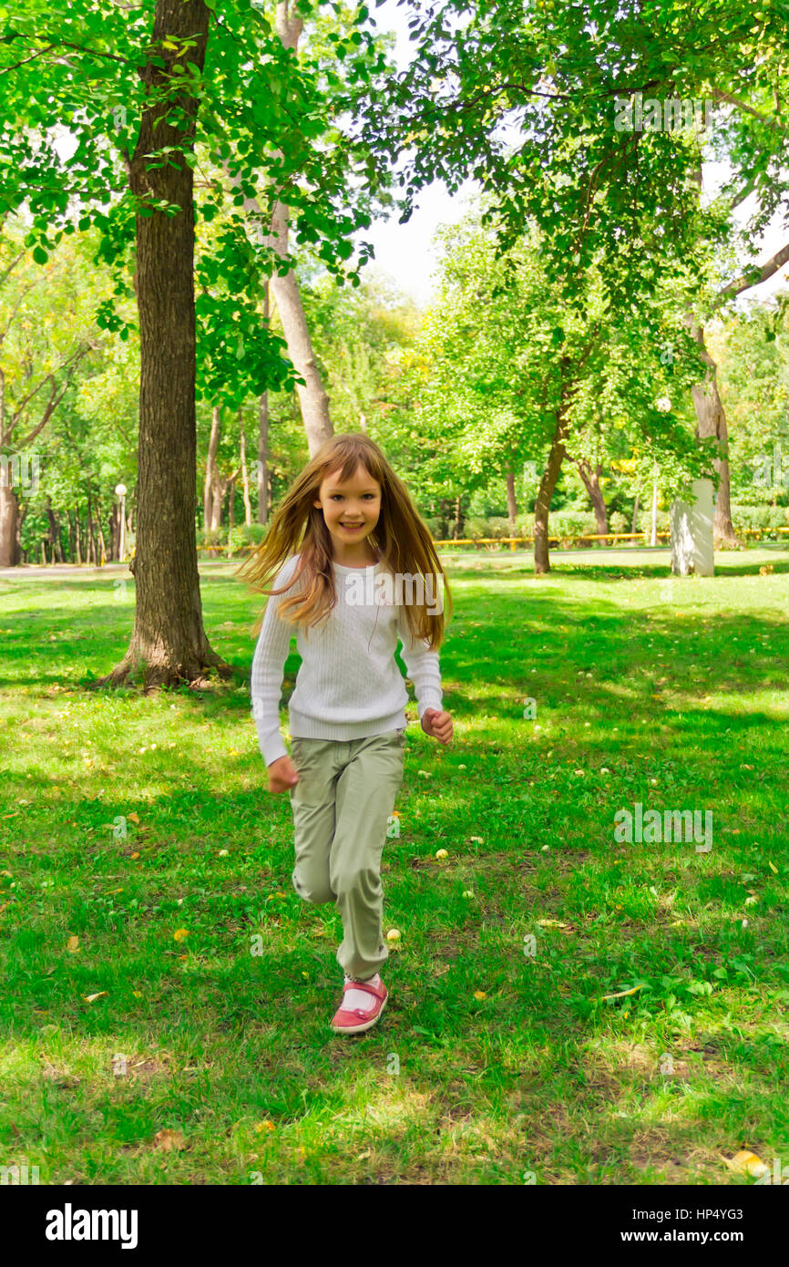 Photo of cute running girl in summer Stock Photo - Alamy