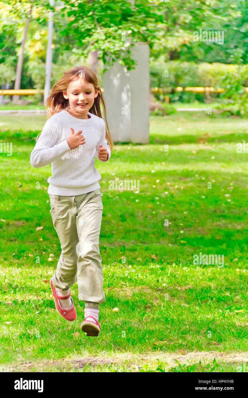 Photo of cute running girl in summer Stock Photo - Alamy
