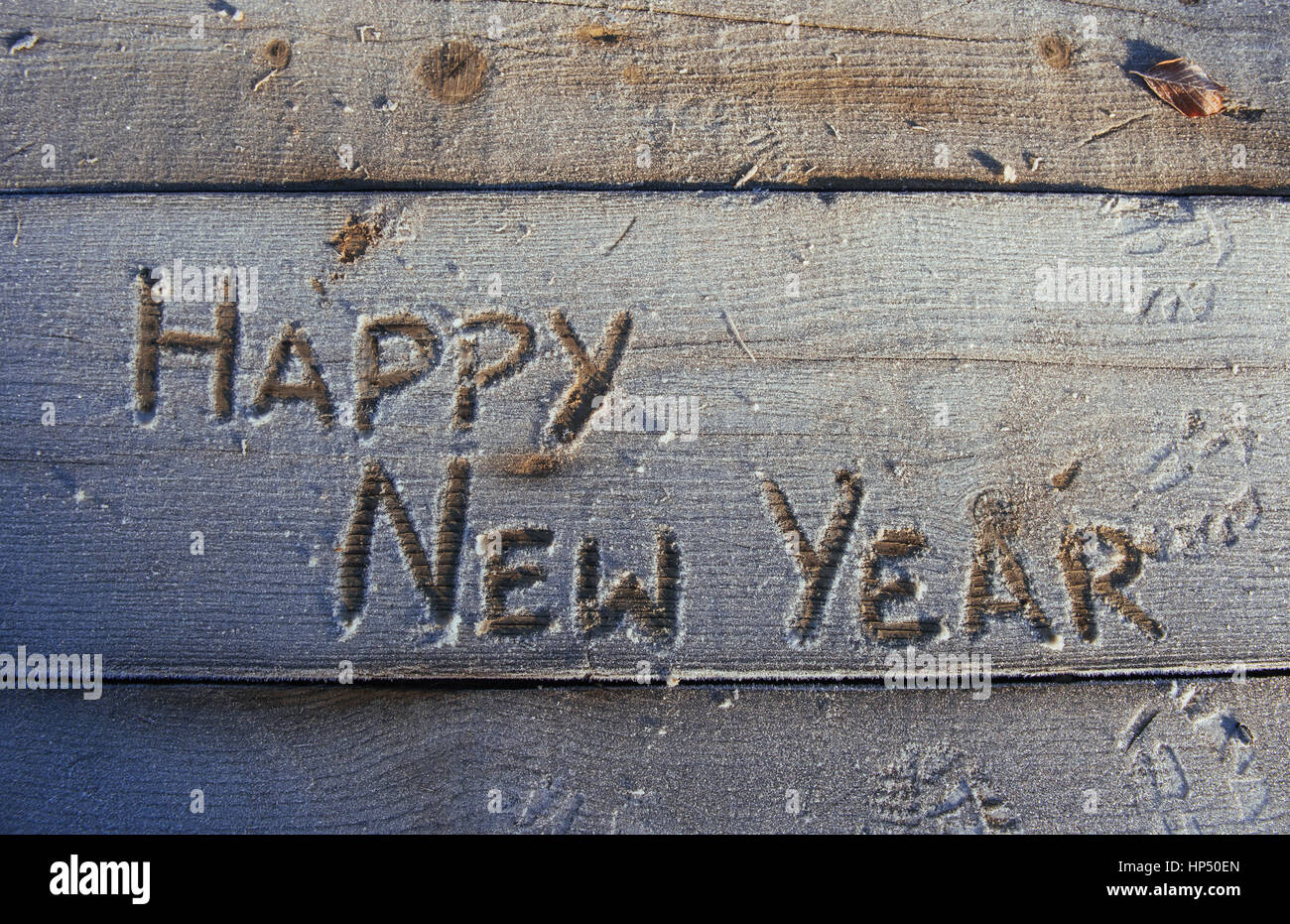 Writing on the snow. Wooden texture Stock Photo - Alamy