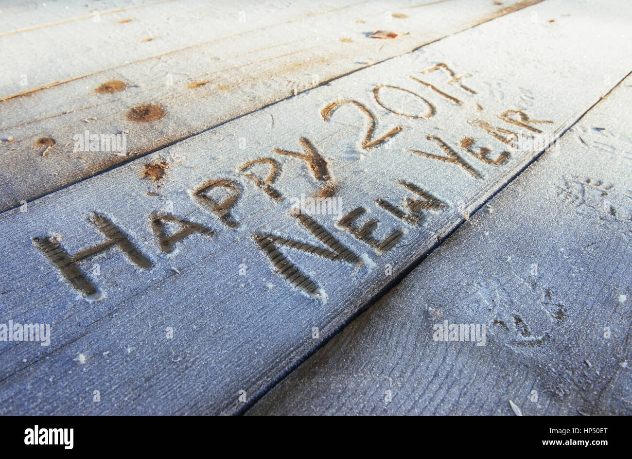 Writing on the snow. Wooden texture Stock Photo - Alamy