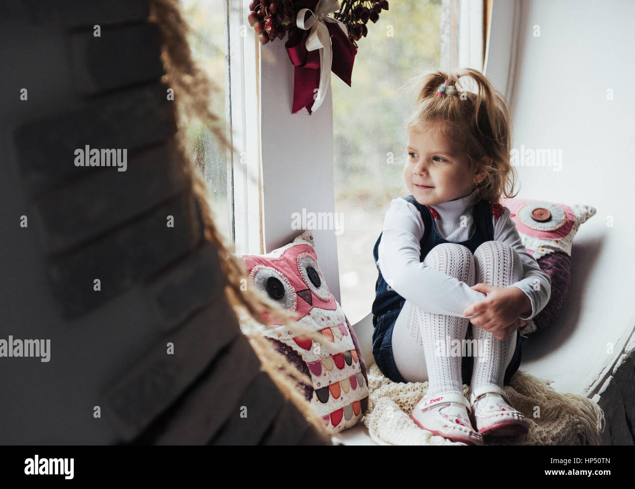 girl sitting by the window Stock Photo - Alamy