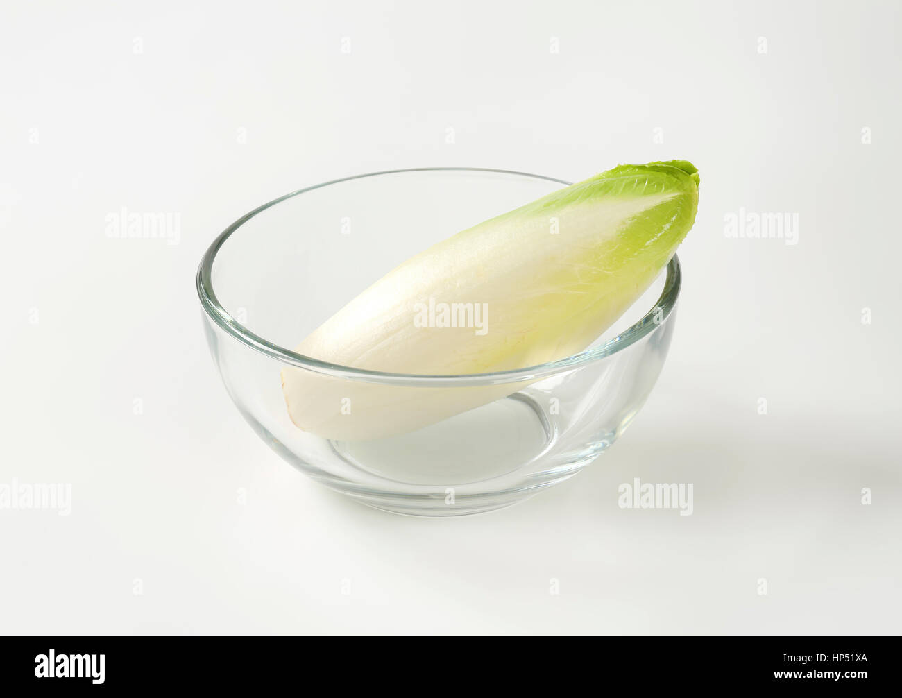 head of fresh belgian endive in glass bowl Stock Photo - Alamy