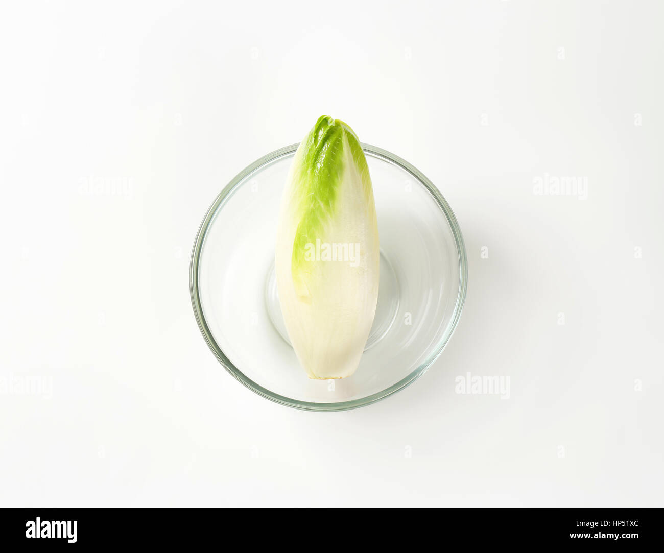 head of fresh belgian endive in glass bowl Stock Photo - Alamy