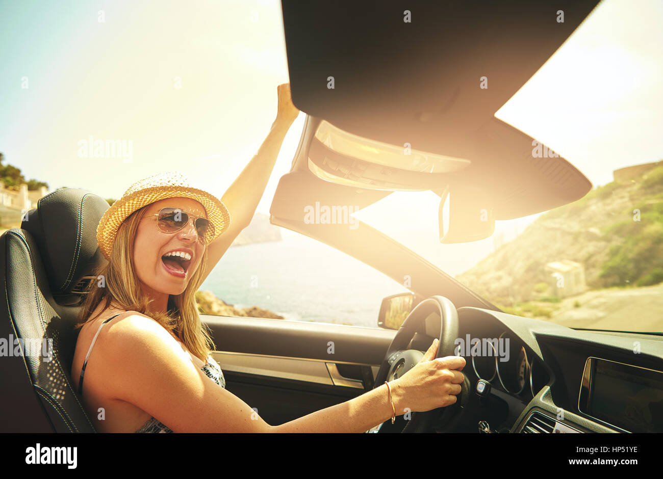 Open top sports car waving hi-res stock photography and images - Alamy