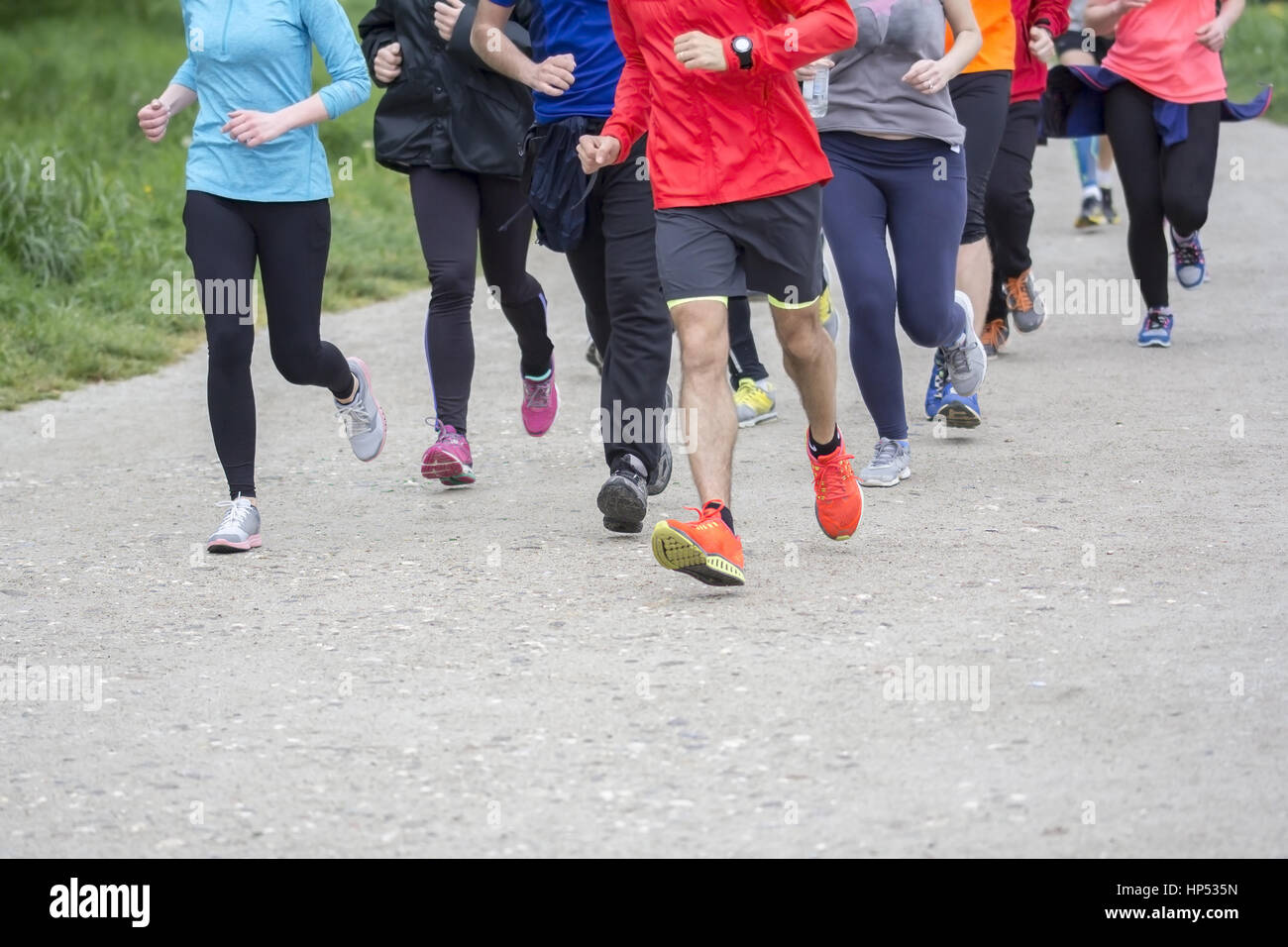 Fitness sport Group of people running jogging outside on road Stock ...