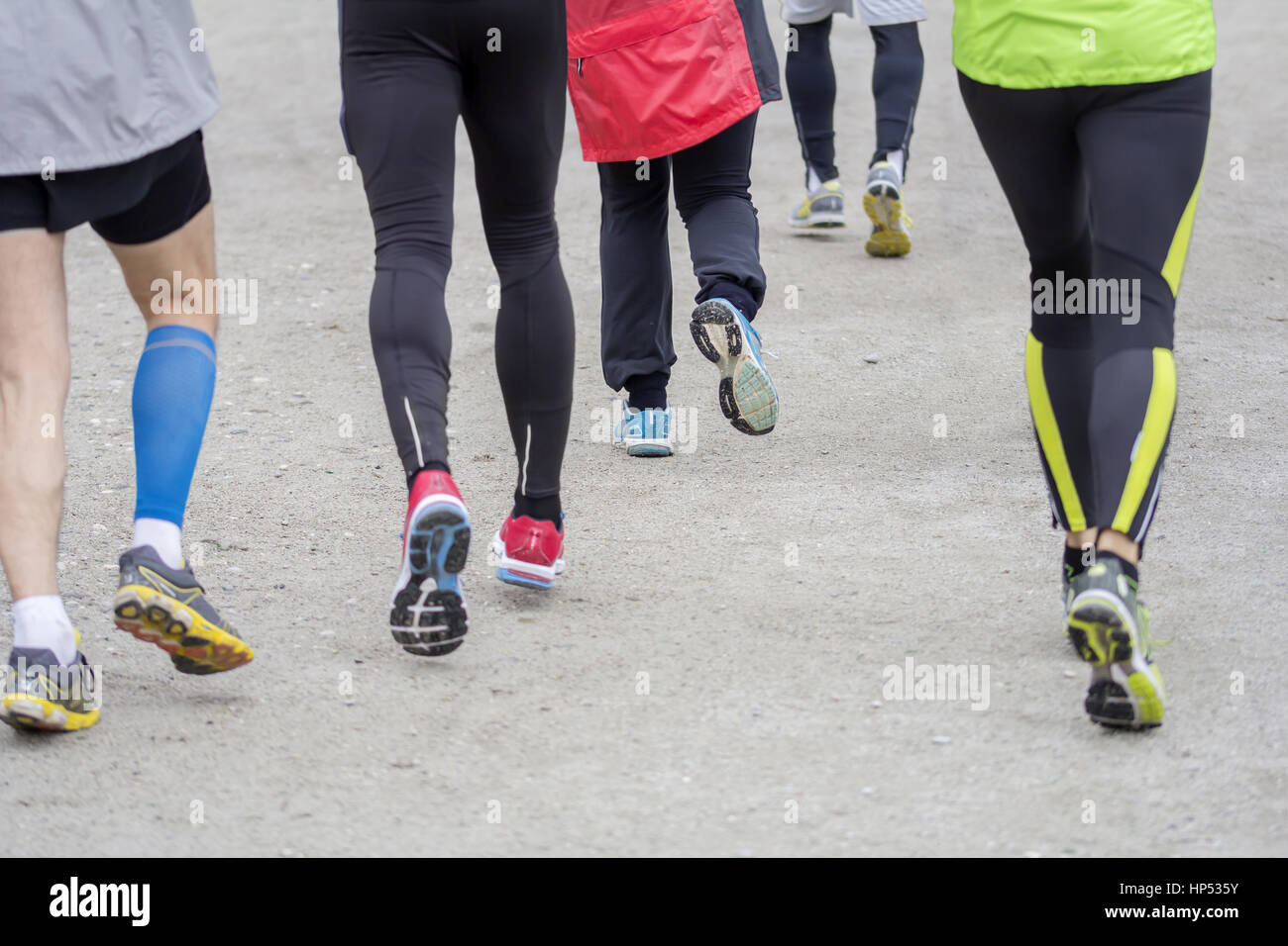 Group of people running outside on road Stock Photo - Alamy