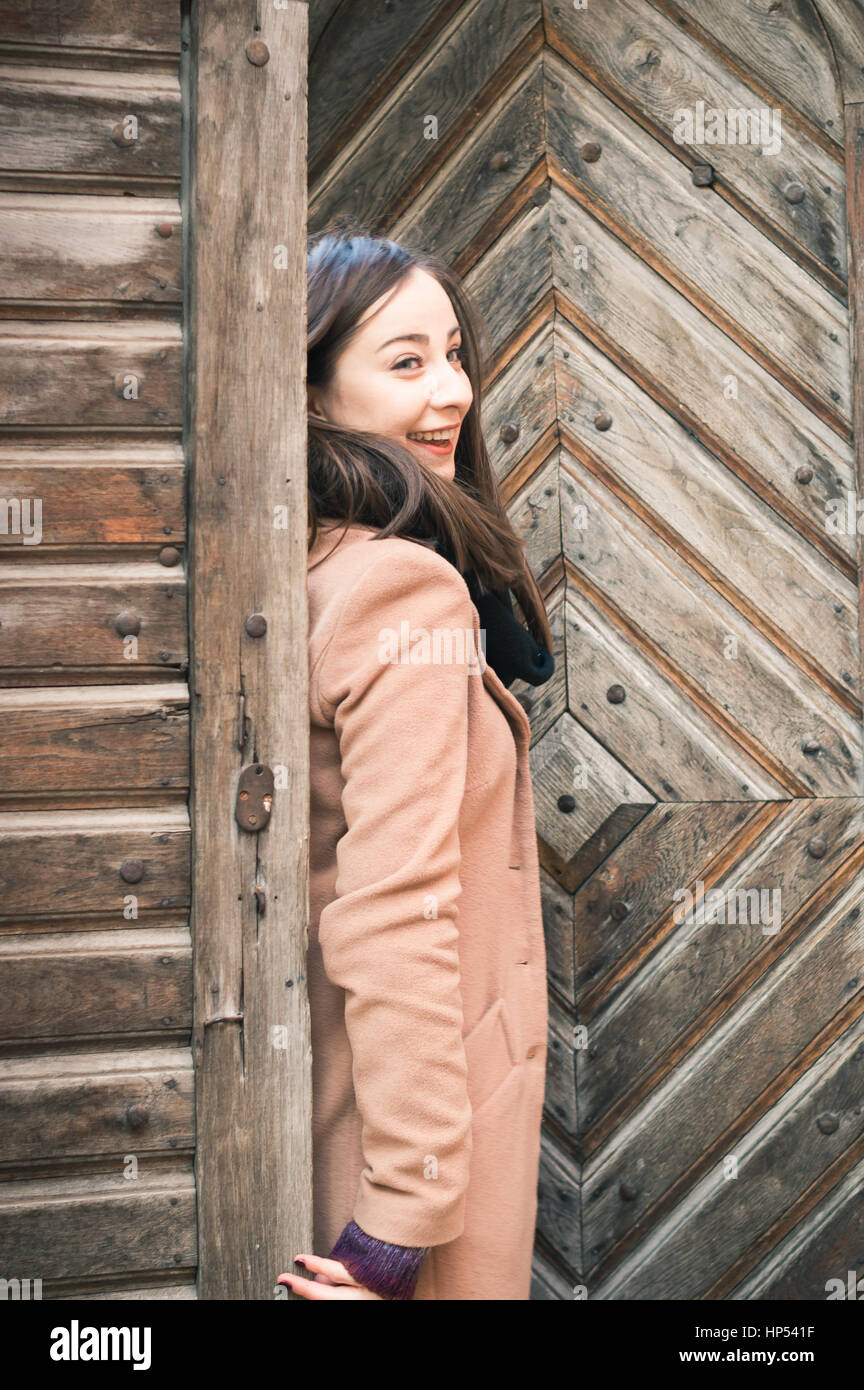 girl near old wooden gate Stock Photo - Alamy