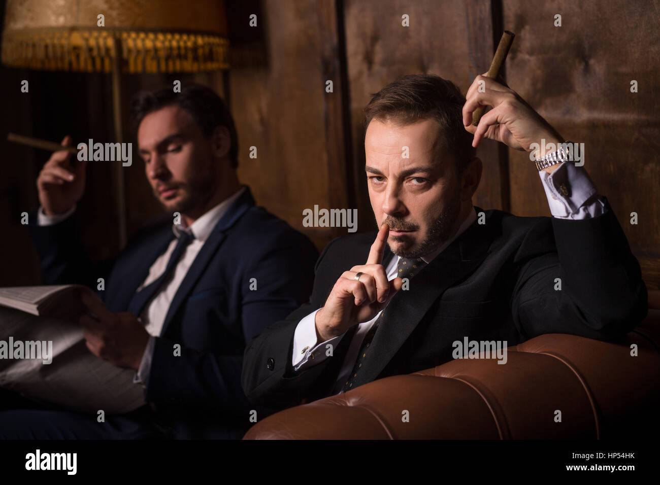 Rich businessmen with cigars Stock Photo - Alamy