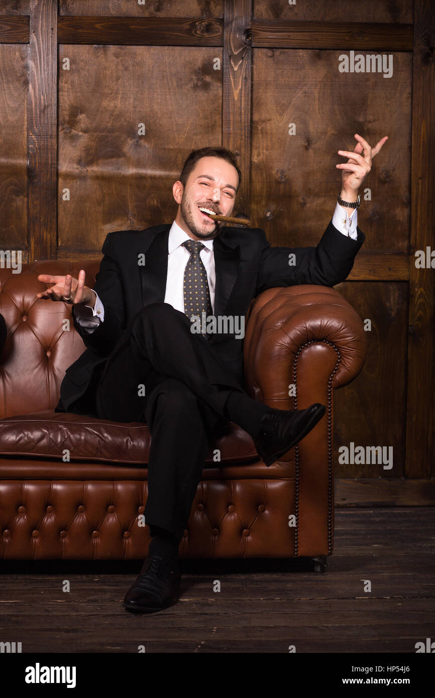 Rich businessman with cigar Stock Photo - Alamy