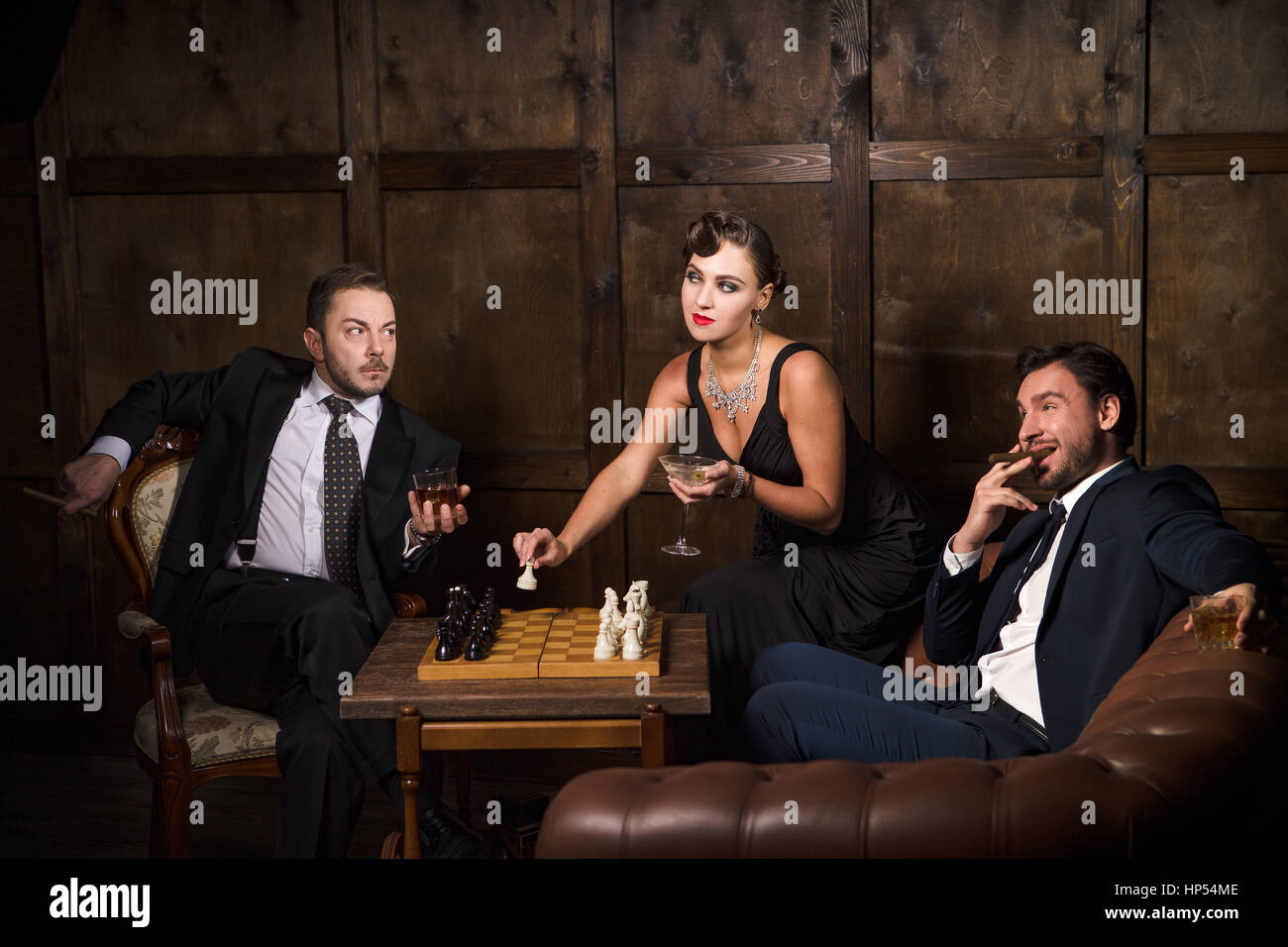 Rich businessmen playing chess Stock Photo - Alamy