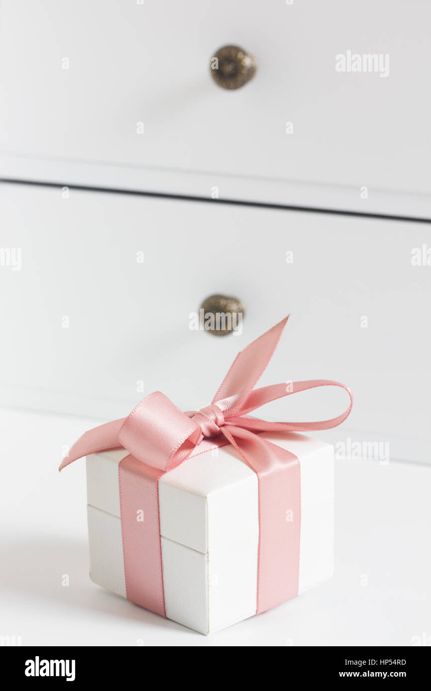 Box with pink ribbon Stock Photo - Alamy