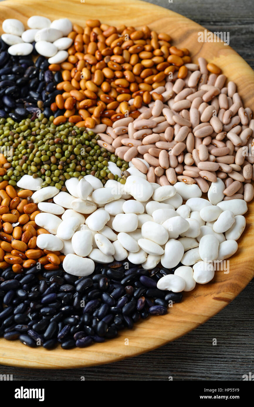 Beans raw mix on large plate, healthy food Stock Photo - Alamy
