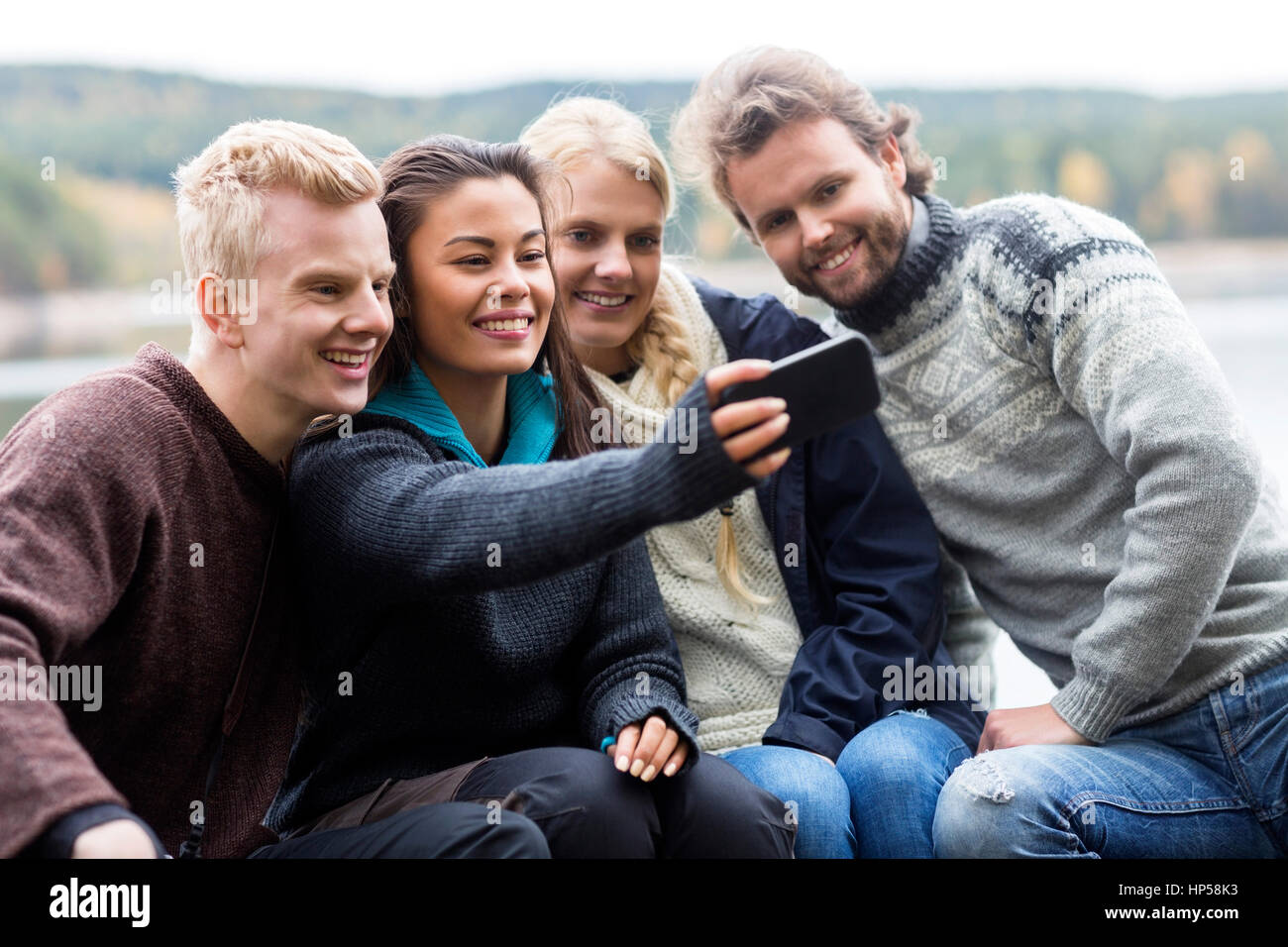 Friends Taking Selfie With Smartphone At Campsite Stock Photo - Alamy