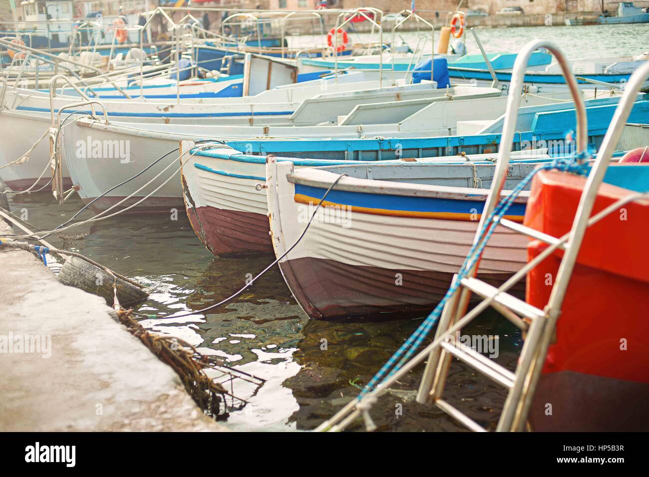 colourful boats docked in the port Stock Photo - Alamy