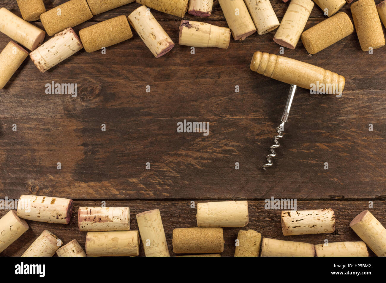 A photo of an old-fashioned corkscrew with corks, shot from above on a ...