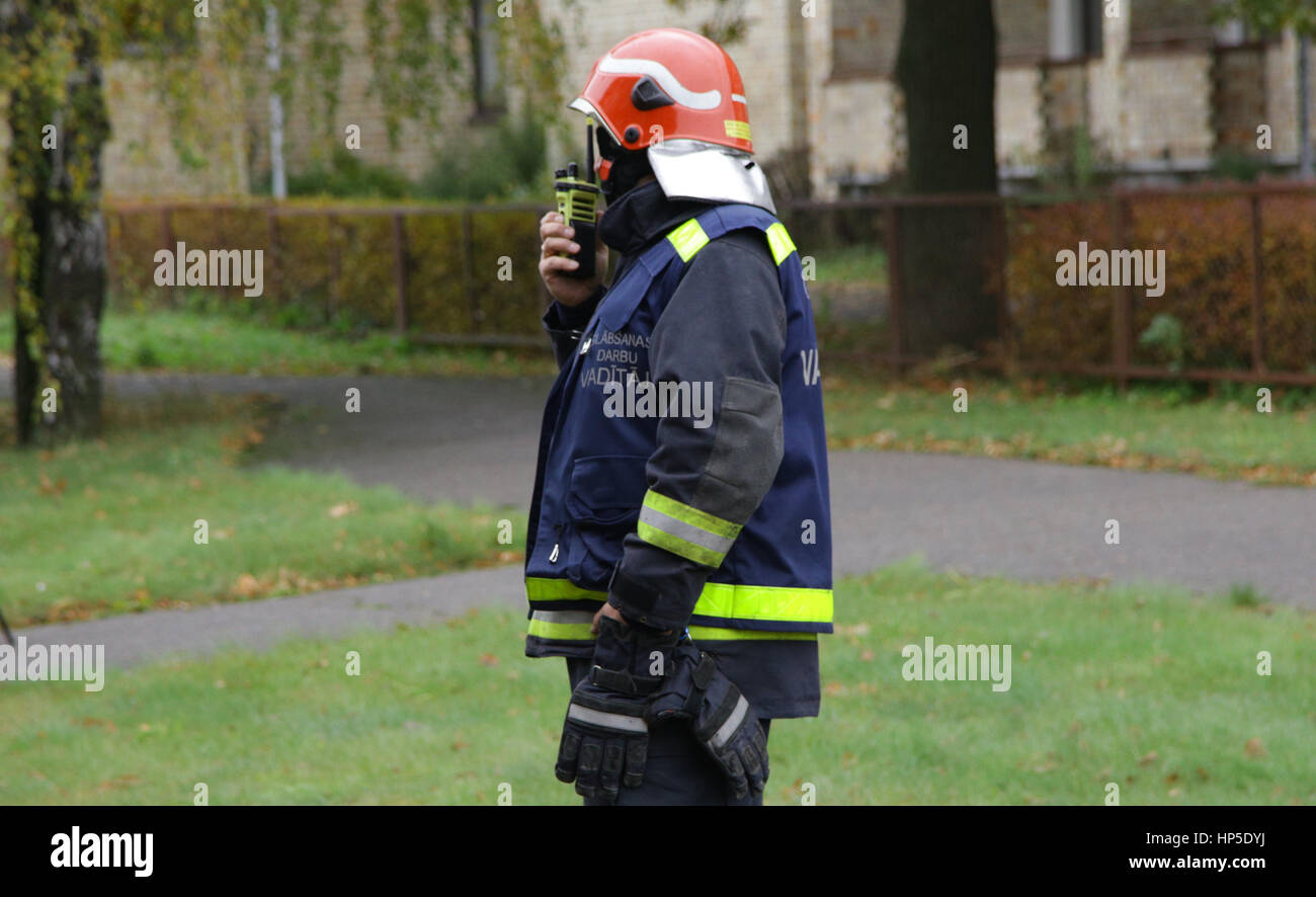 Fireman speaking radio Stock Photo - Alamy