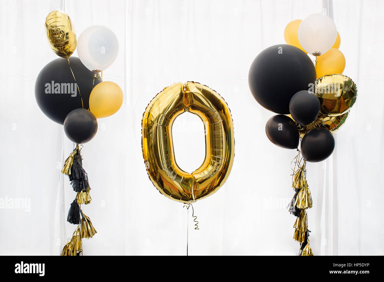 Golden number zero balloon on a white background Stock Photo - Alamy