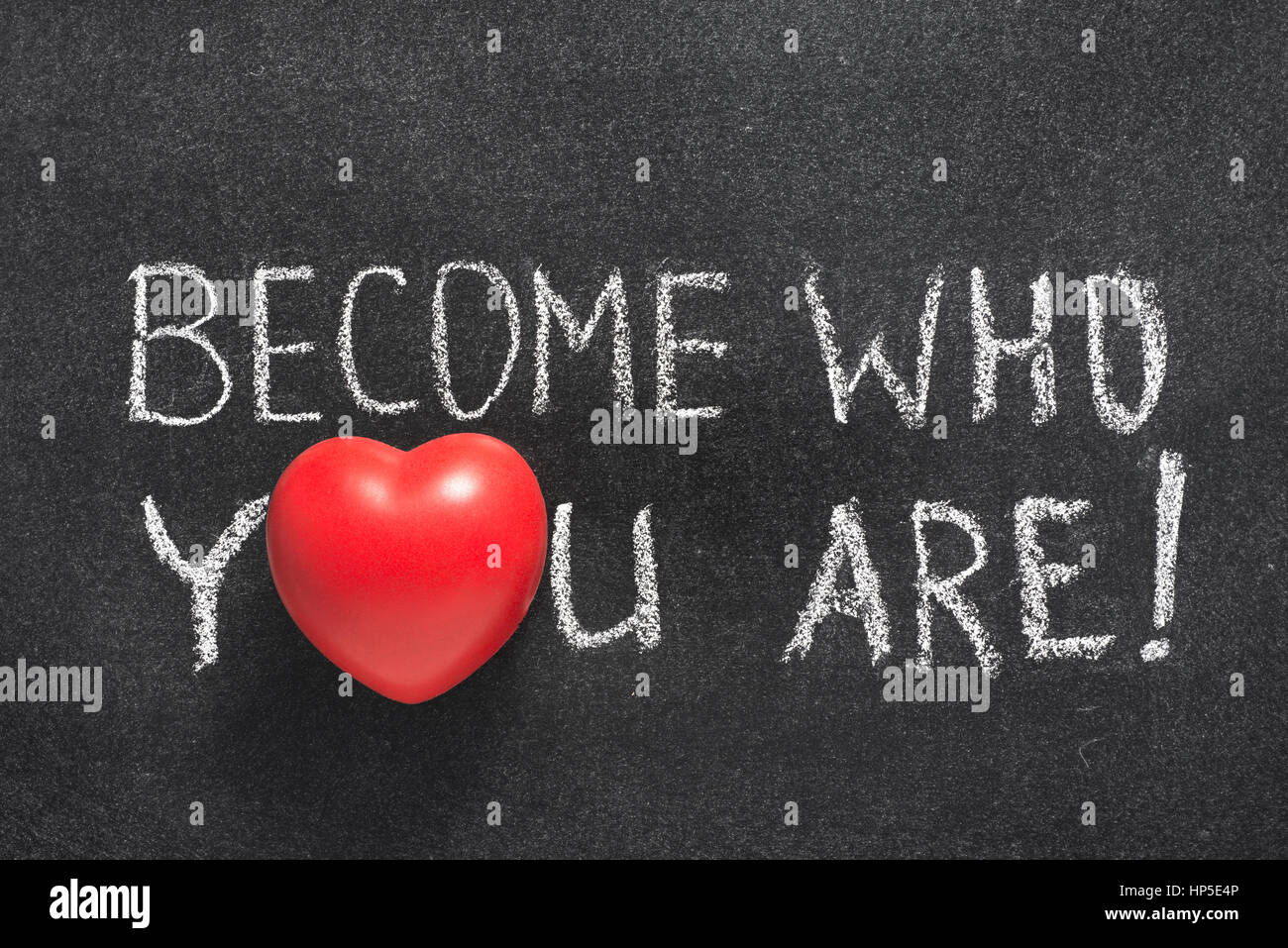 become who you are phrase handwritten on blackboard with heart symbol ...