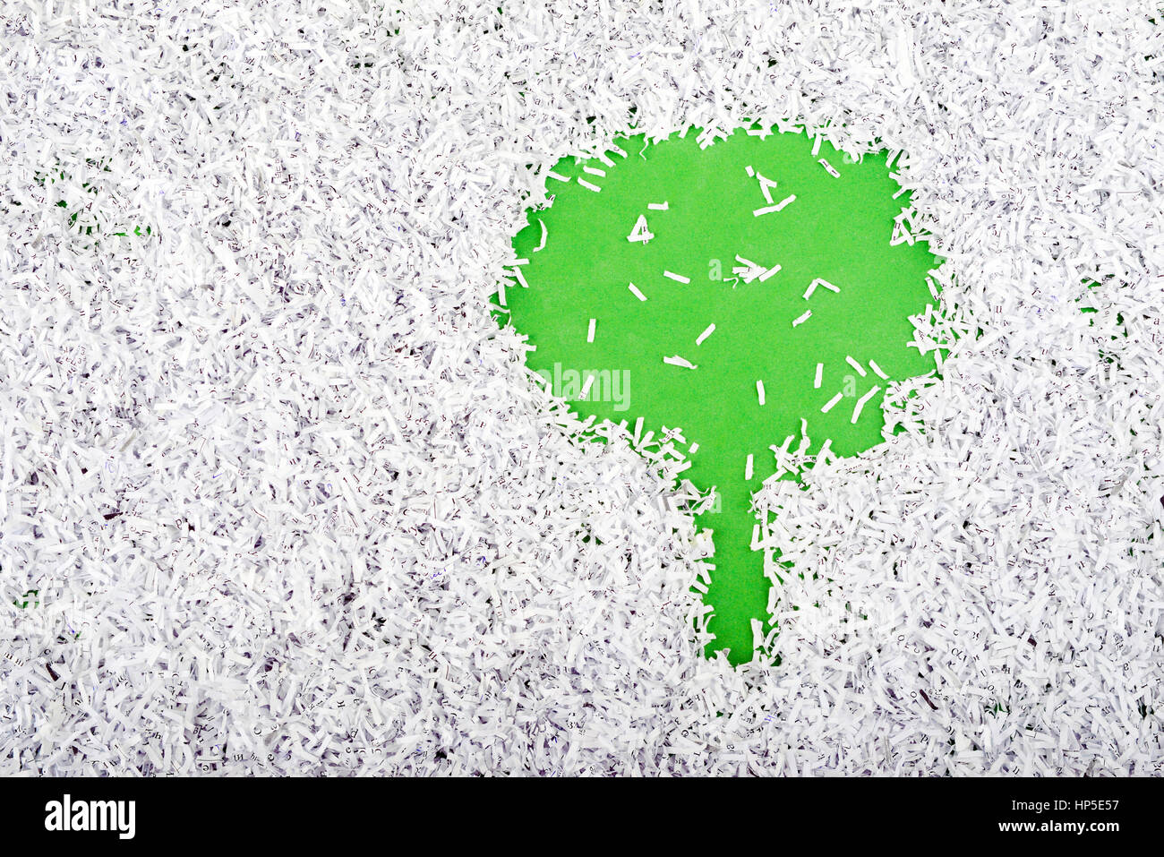 simple green tree symbol made inside of shredded paper heap Stock Photo ...