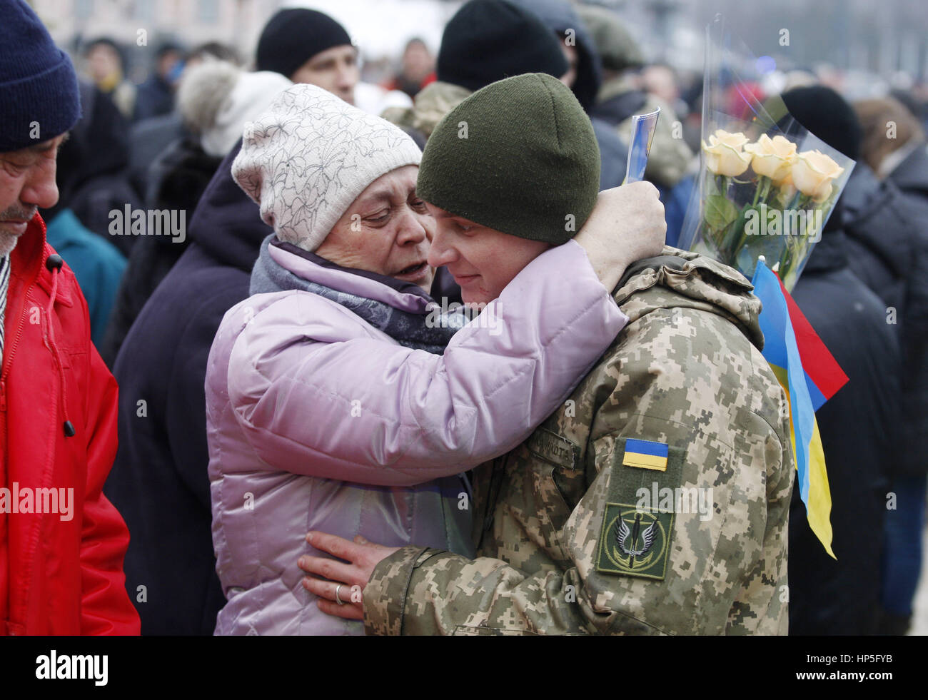 Kiev, Ukraine. 18th Feb, 2017. A woman hugs an Ukrainian soldier during ...
