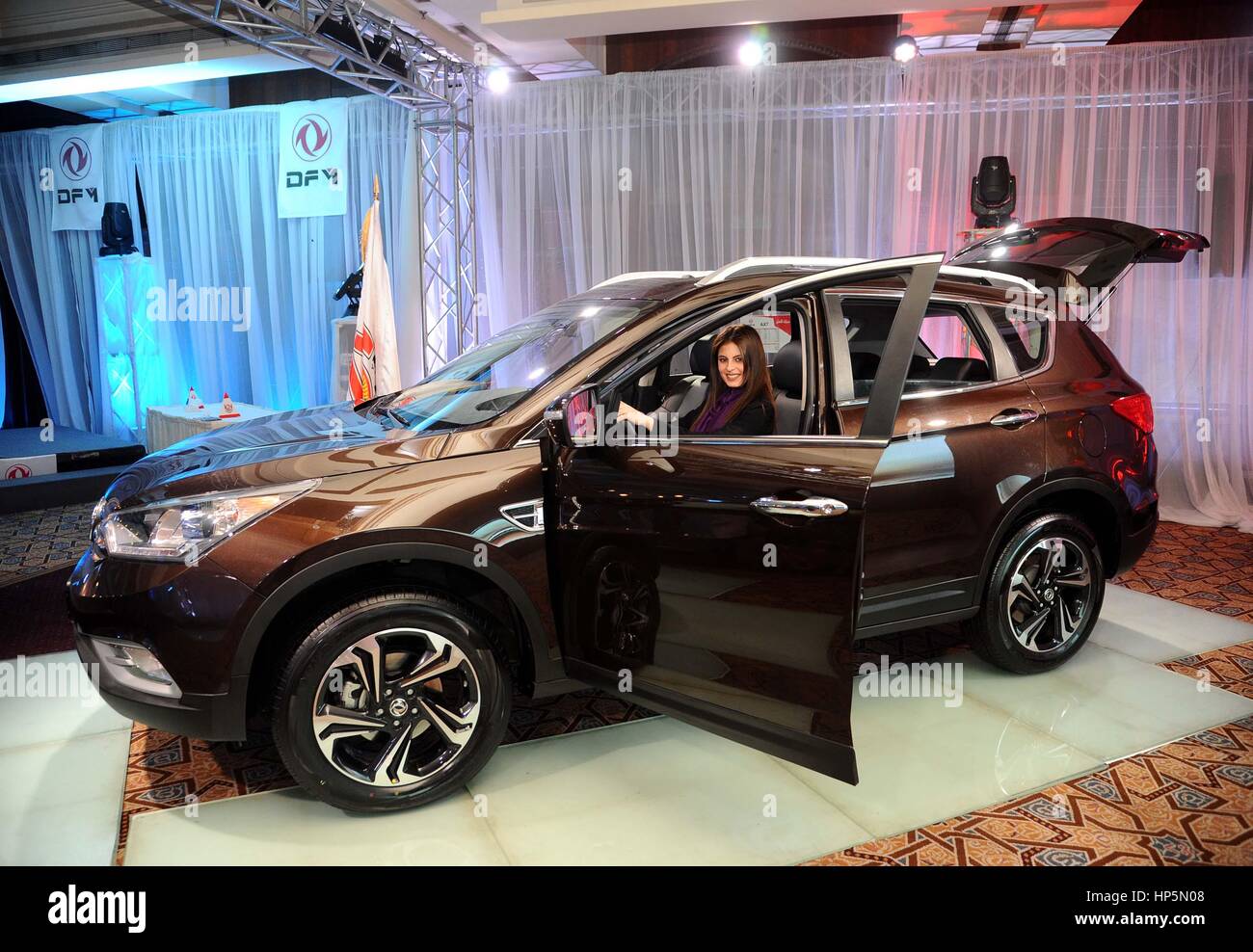 Damascus, Syria. 18th Feb, 2017. A model displays the new DFM AX7 SUV ...