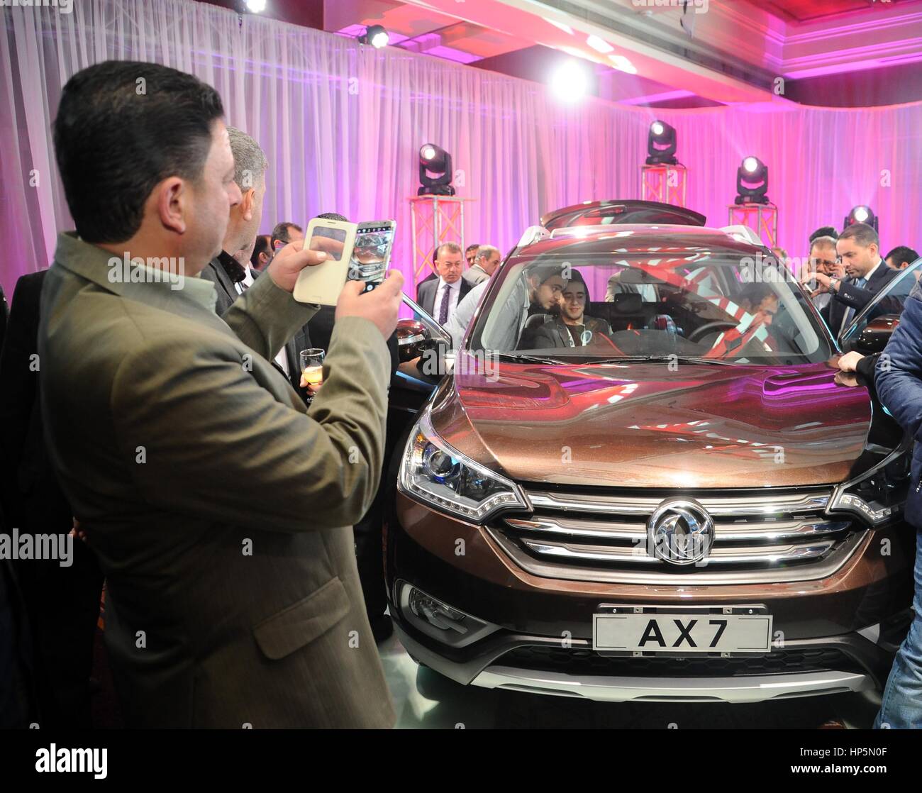 Damascus, Syria. 18th Feb, 2017. People watch the new DFM AX7 SUV at an ...