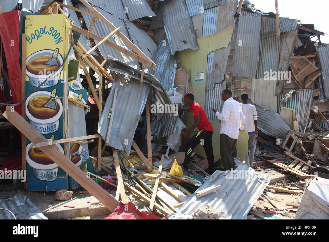 Mogadishu, Somalia. 19th Feb, 2017. Local residents stand at the ...