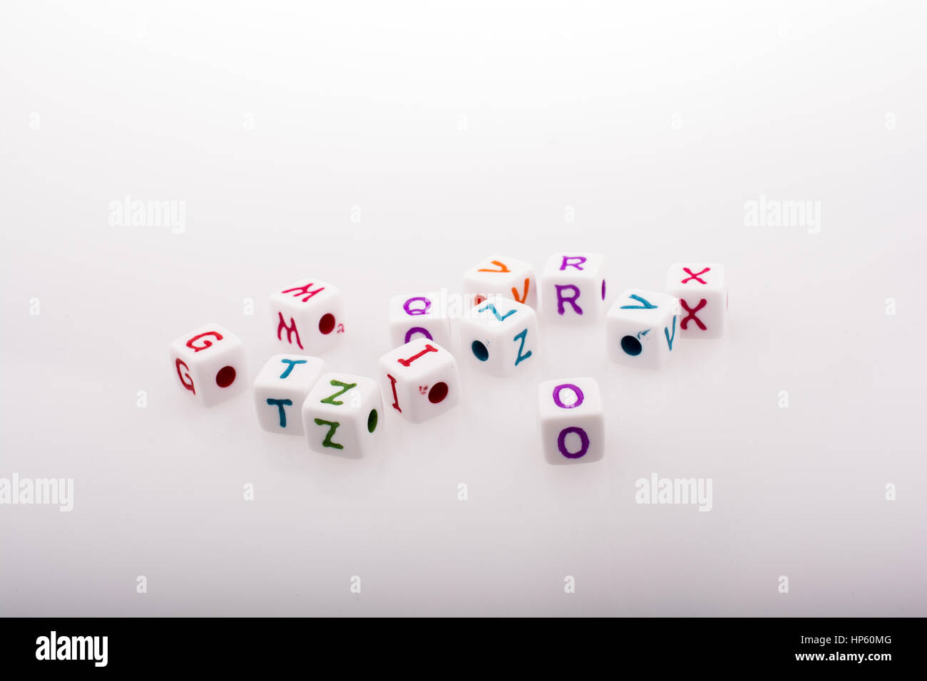 Colorful alphabet letter cubes on a white background Stock Photo - Alamy