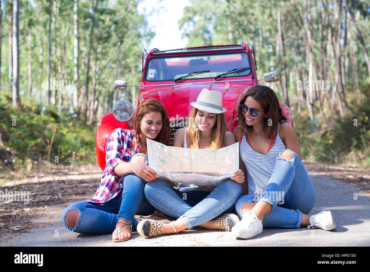 Group of friends on a roadtrip through countryside Stock Photo - Alamy