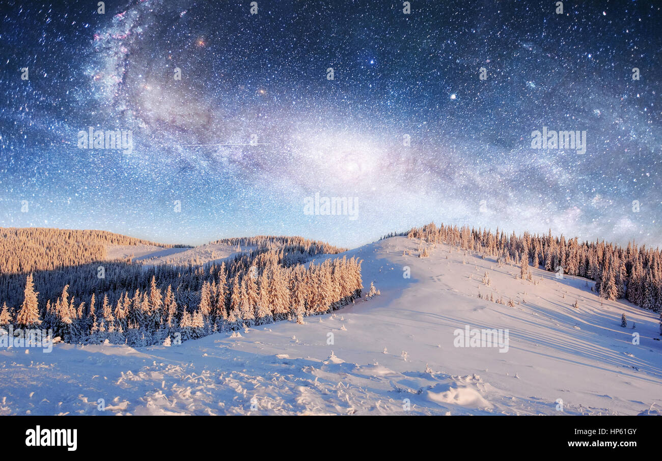 starry sky in winter snowy night. fantastic milky way in the New Stock Photo - Alamy