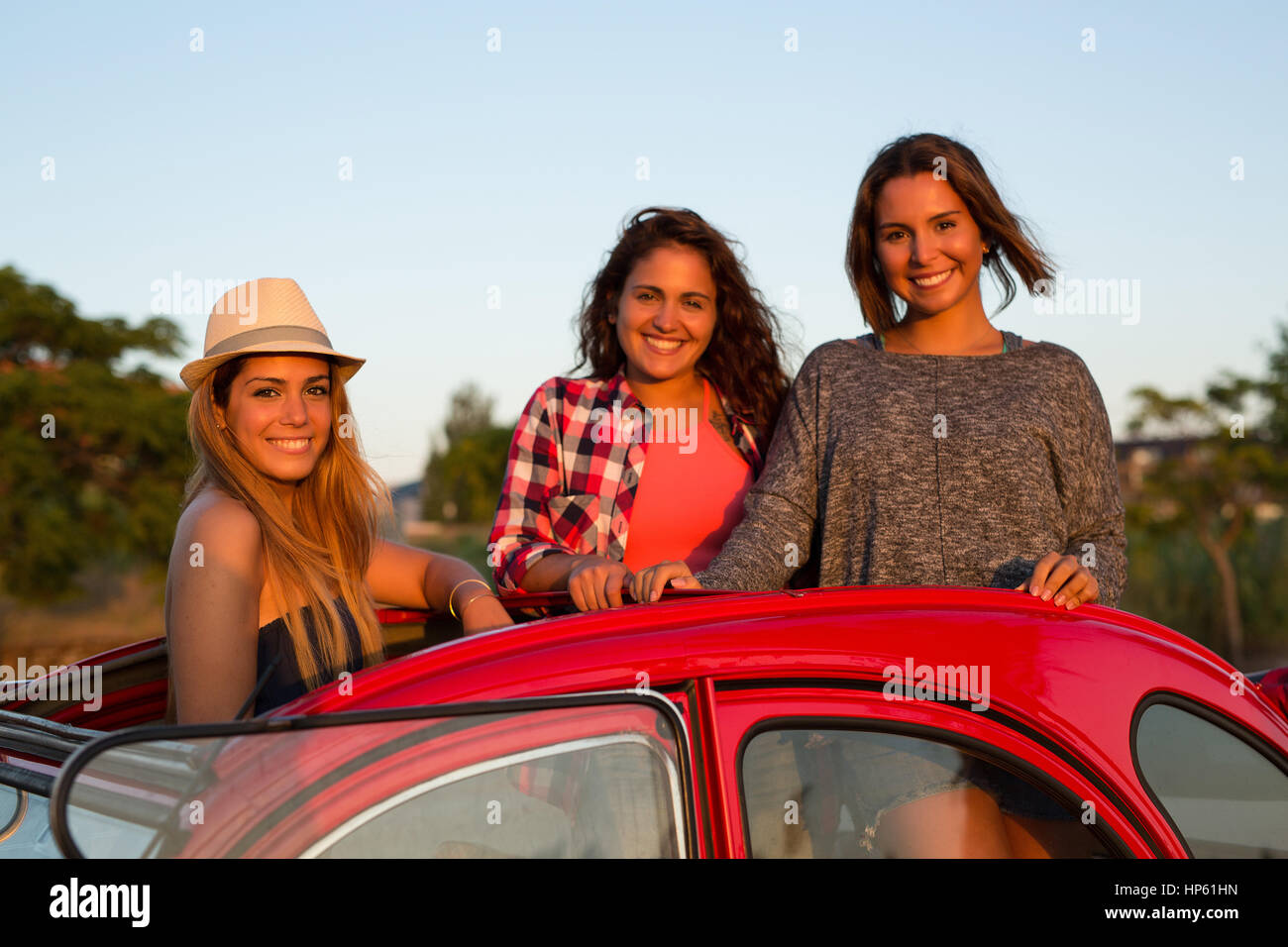 Group of friends on a roadtrip through countryside Stock Photo - Alamy