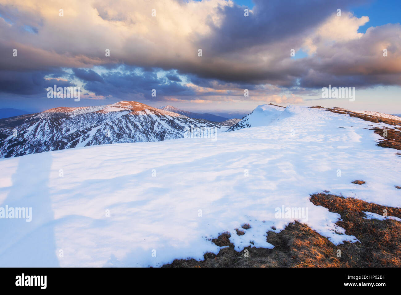 Colorful spring sunset over the mountain ranges Stock Photo - Alamy