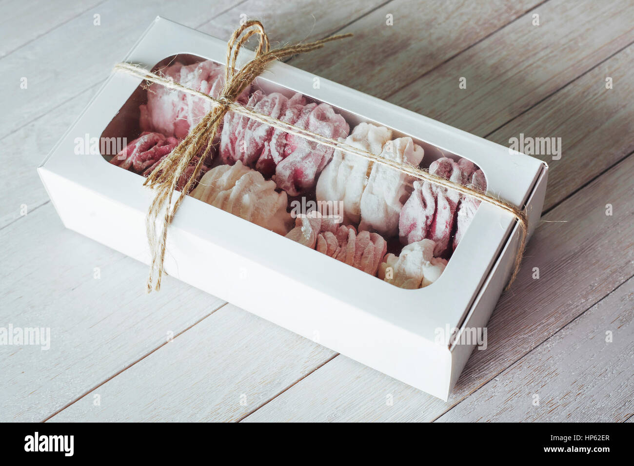 marshmallow in a box on white wooden background Stock Photo - Alamy