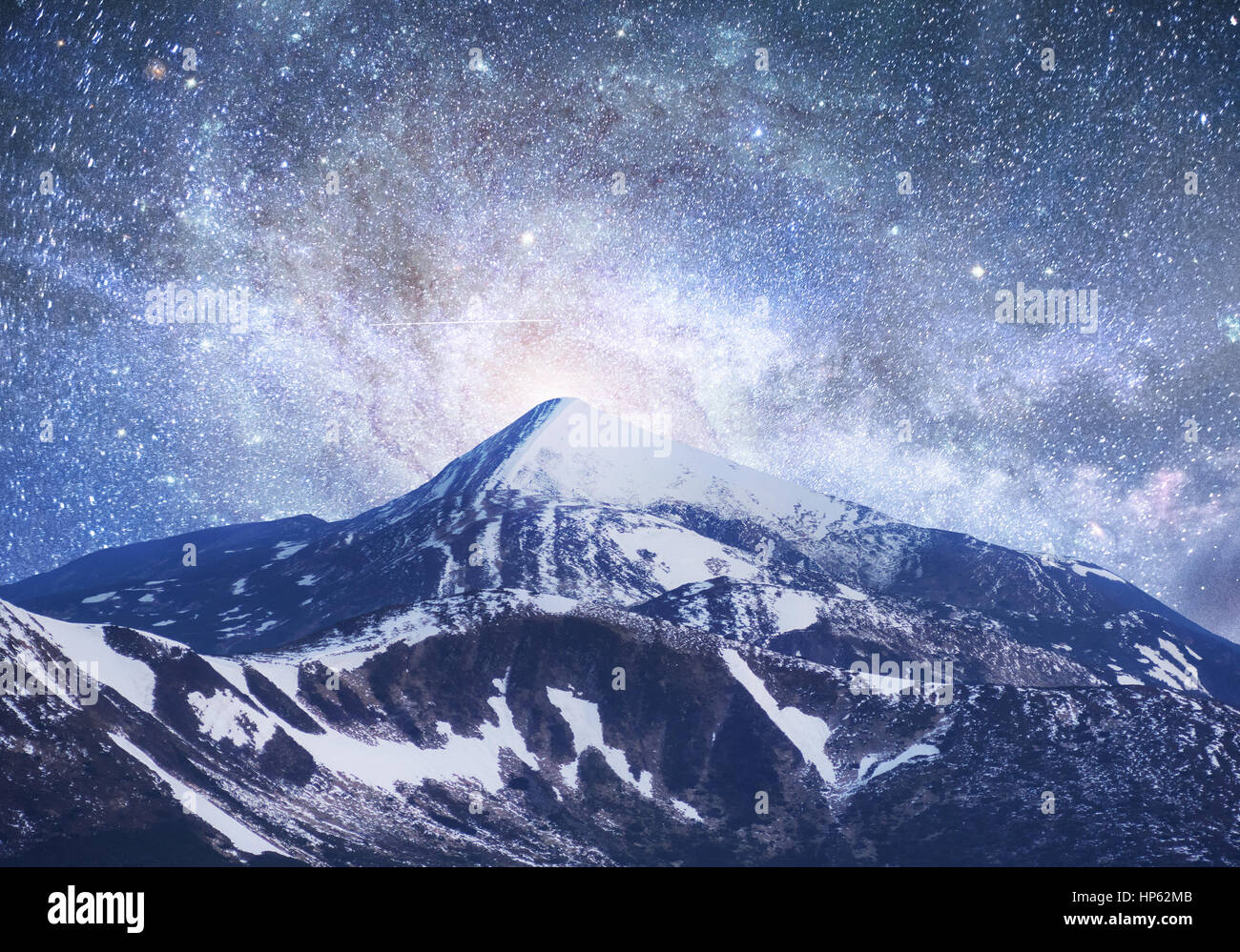 Fantastic starry sky. Beautiful winter landscape and snow-capped Stock ...