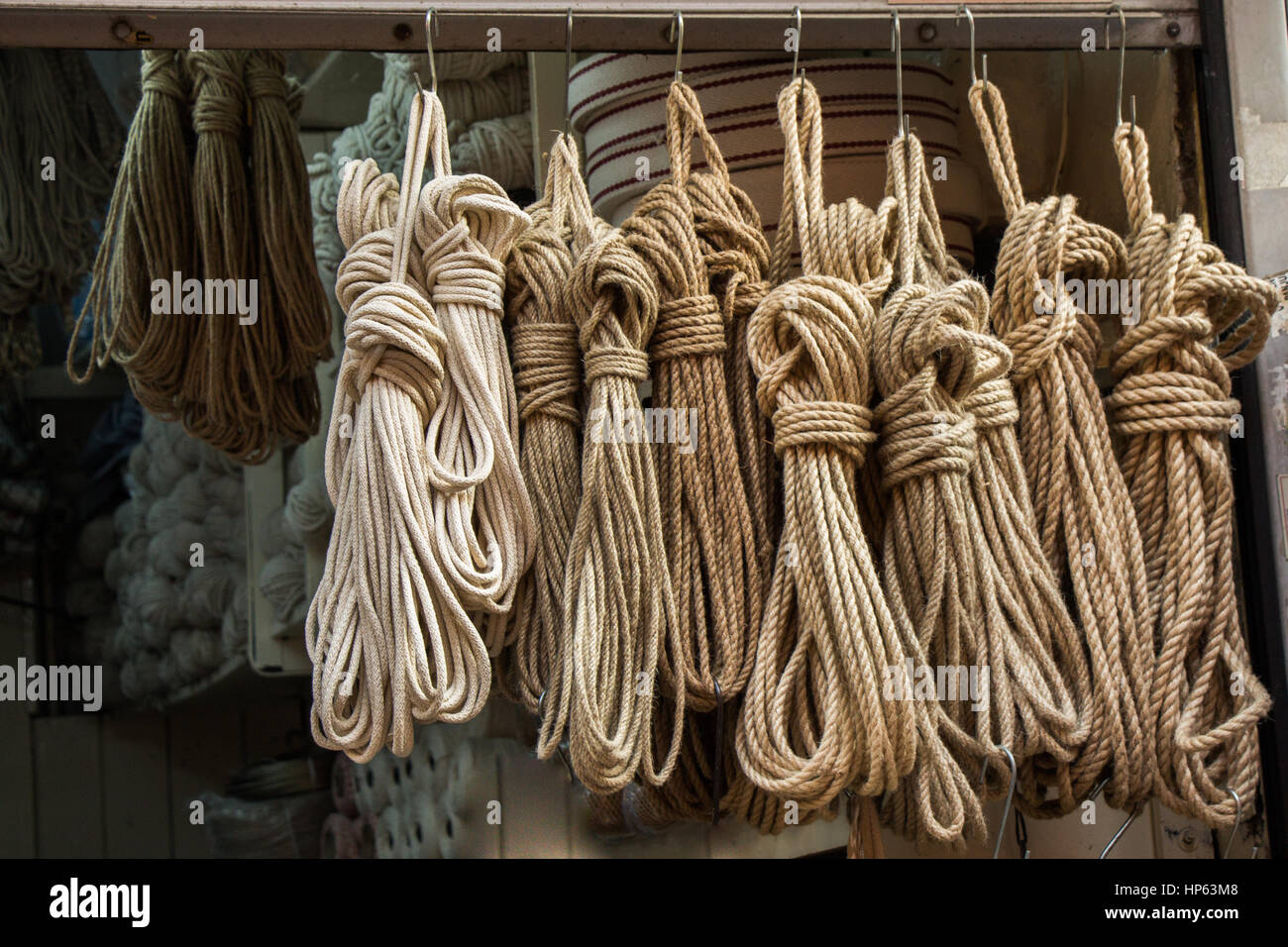 Bundle of linen rope in a market place Stock Photo - Alamy