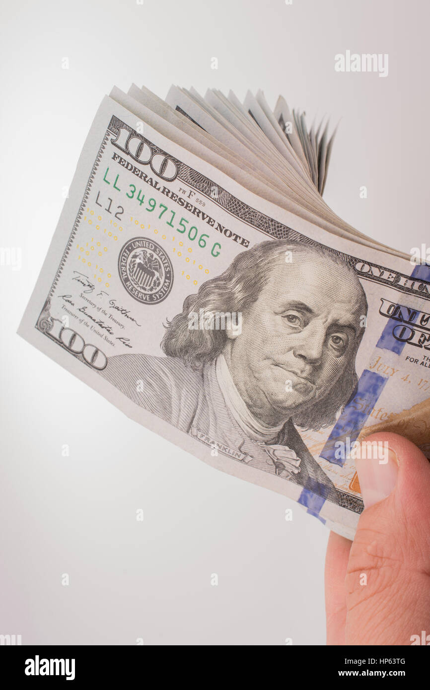 American 100 dollar banknotes made of paper placed on white background ...