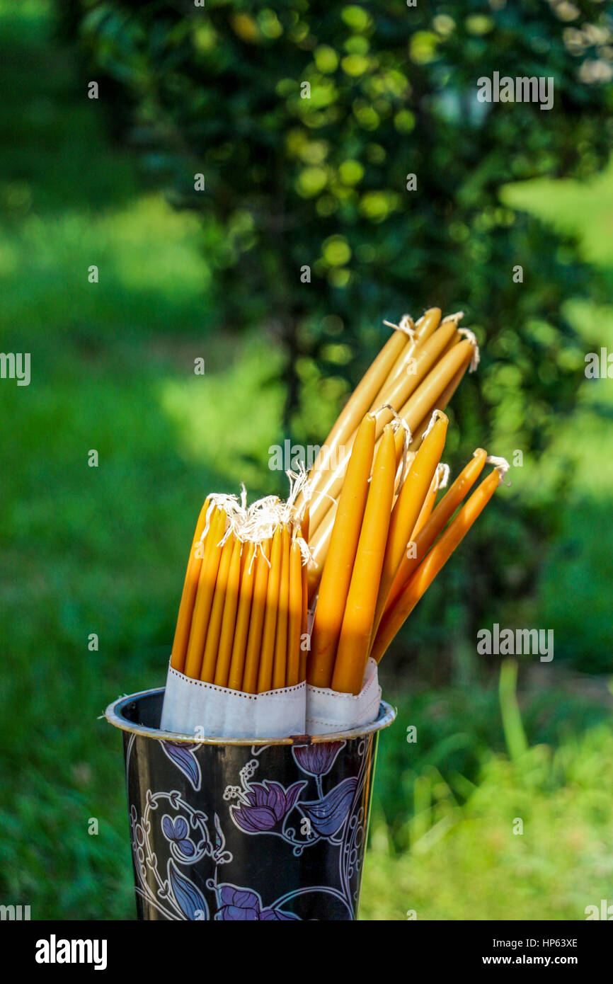 Bundle of yellow color candle sticks Stock Photo - Alamy
