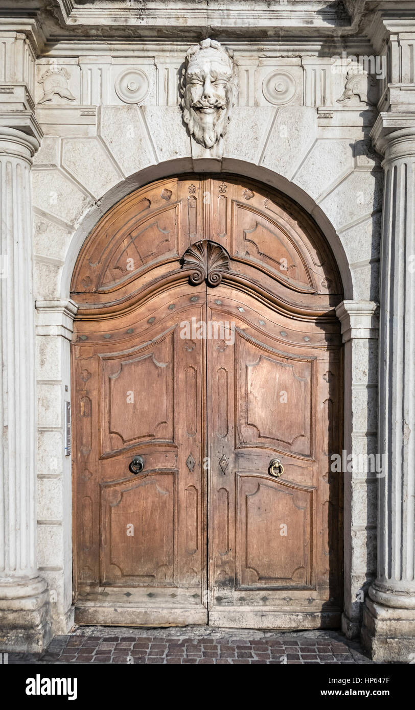 Arched entrance of a medieval palace with carved wooden door Stock ...